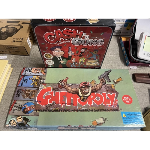 A boxed Ghettopoly board game (unchecked) and a new sealed Cash N Guns ...