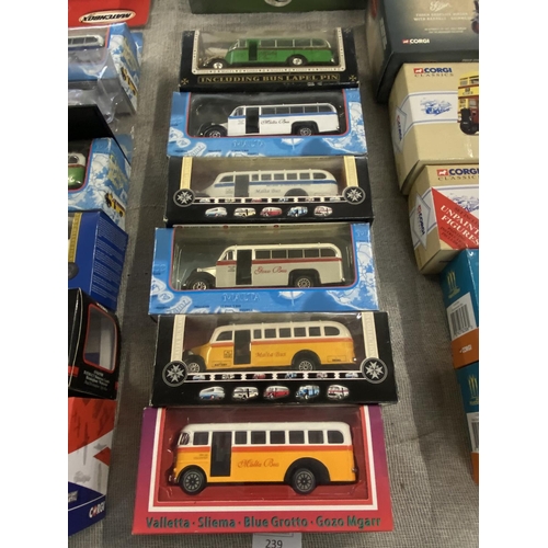 Six boxed assorted die cast bus models