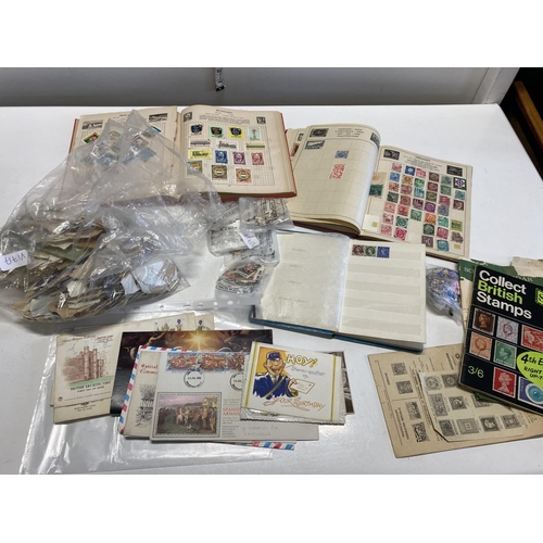 A selection of vintage stamp albums and loose stamps