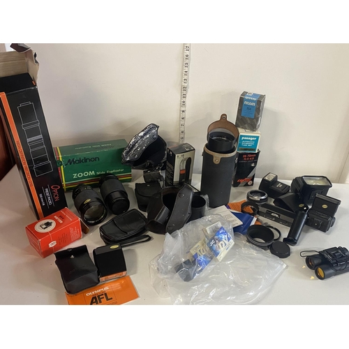 A box of assorted camera lenses and accessories, shipping unavailable