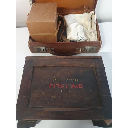 A vintage WW1 period first aid kit, suitcase and child's gas mask ...