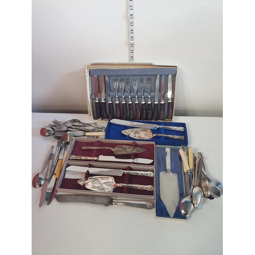 A selection of boxed and loose cutlery
