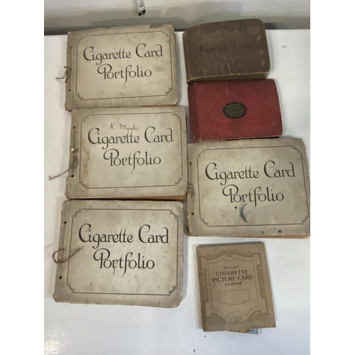 A job lot of vintage cigarette card albums