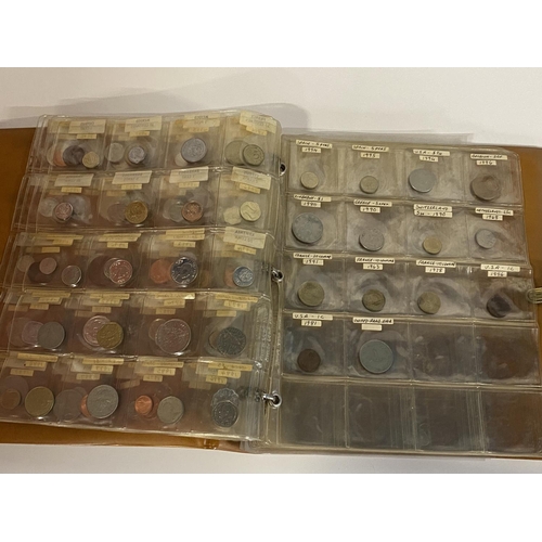 A vintage world coin album cointaing some silver coins