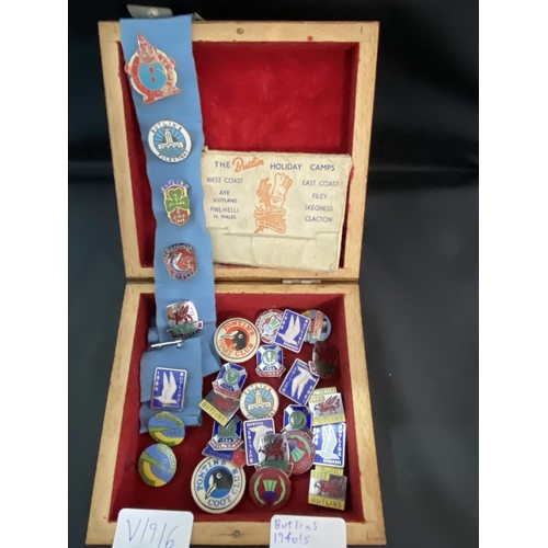 A box of assorted vintage Butlins badges from 1940's onwards