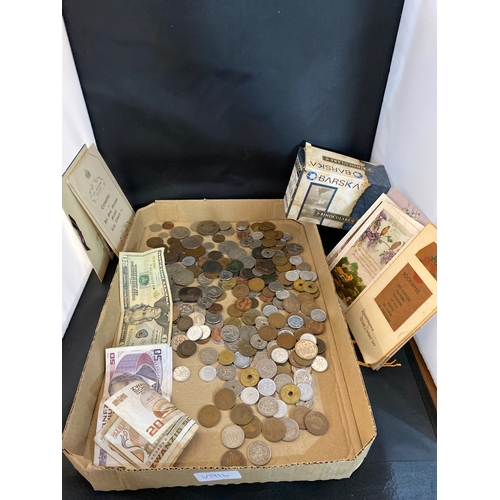 A Collection of World Coins, Banknotes, and Ephemera