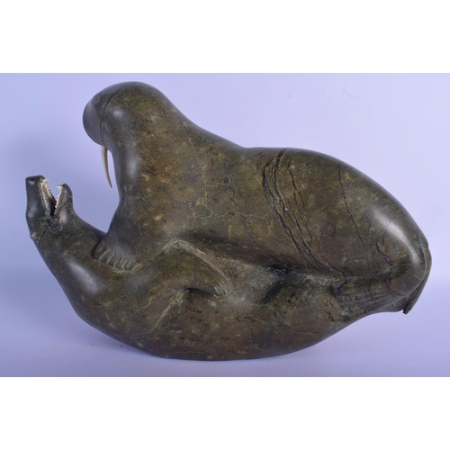 A LARGE NATIVE AMERICAN CANADIAN INUIT CARVED STONE ANIMAL GROUP ...