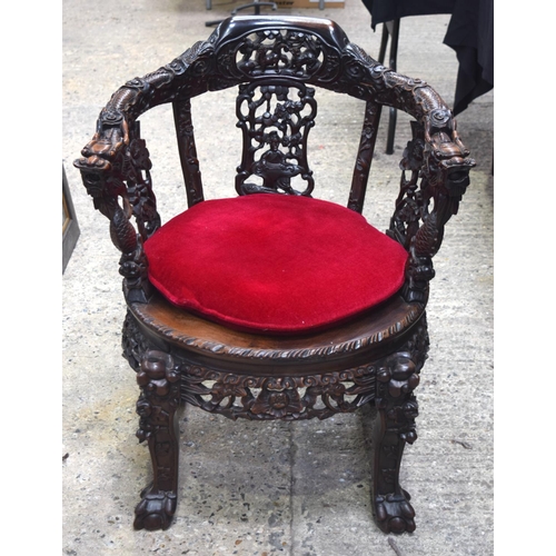 A FINE 19TH CENTURY CHINESE CARVED HONGMU DRAGON ARM CHAIR with floral ...