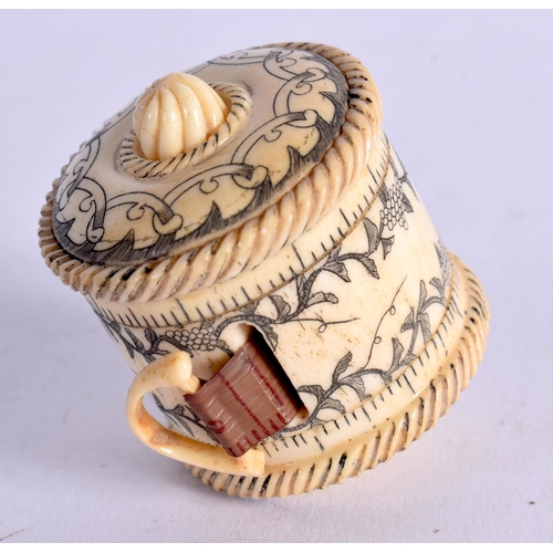 A CARVD BONE TAPE MEASURE. 5cm x 3.8cm weight 41.9g