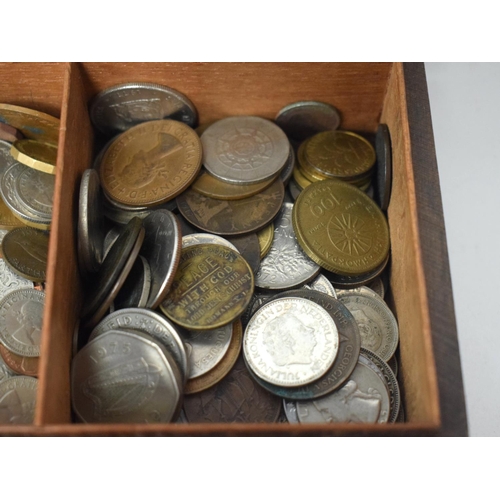 A BOX OF COINS. (qty)
