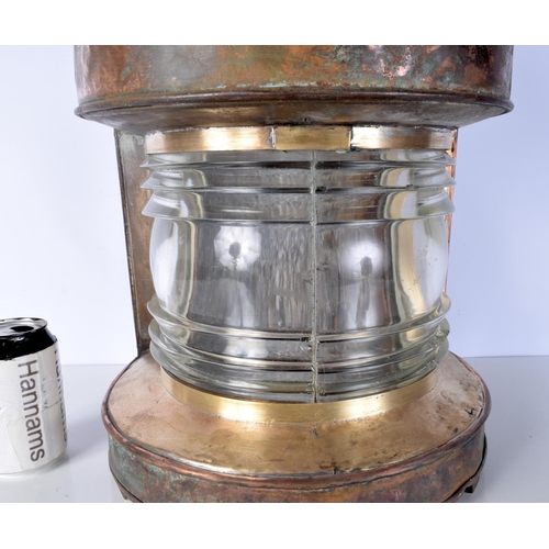 An antique ships masthead light 58 x 32 cm.