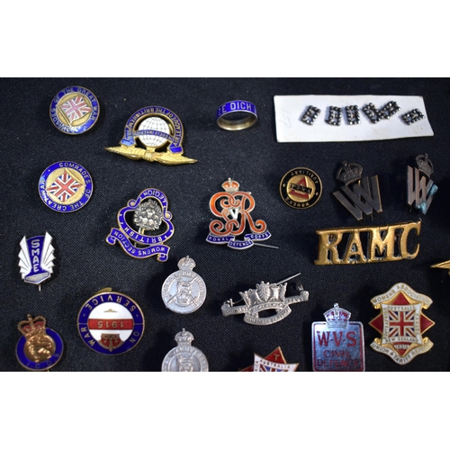 A collection of enamelled badges some military (Qty).