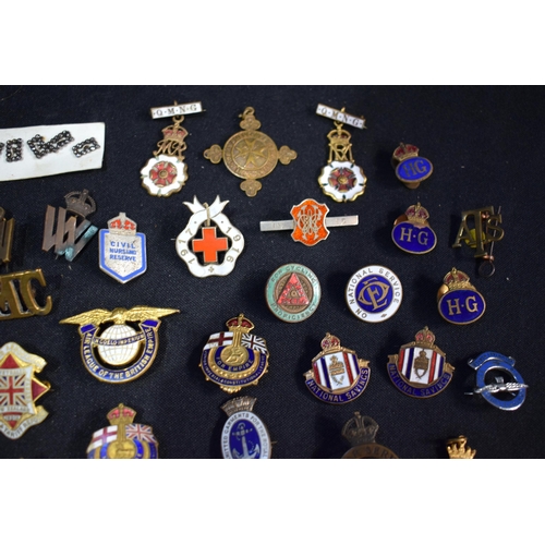 A collection of enamelled badges some military (Qty).