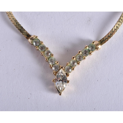 A Christian Dior Gold Tone Necklace set with Gems. 45cm long, weight 5.9g