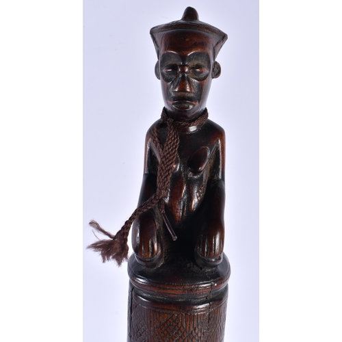 A LOVELY AFRICAN TRIBAL CARVED WOOD FERTILITY POUNDER formed with a ...