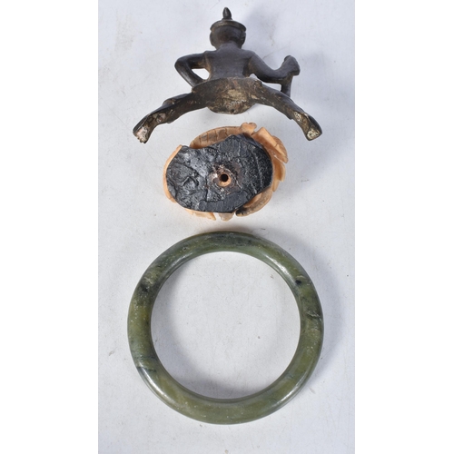 A CHINESE STONE BANGLE together with a tagua nut snake & an early ...