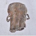A 15th Century lead Pilgrim's Ampulla decorated with a central flower 5cm.