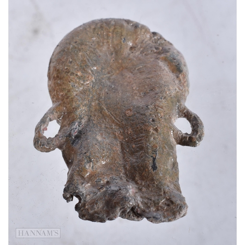 A 15th Century lead Pilgrim's Ampulla decorated with a central flower 5cm.