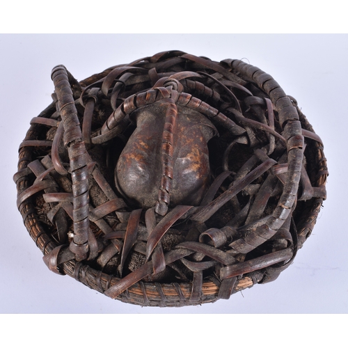 AN UNUSUAL AFRICAN TRIBAL CARVED WICKER BAMBOO SKULL BASKET. 21 cm wide.