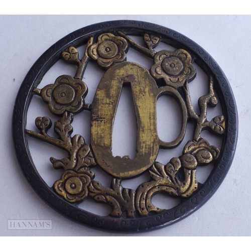 A 19TH CENTURY JAPANESE MEIJI PERIOD BRONZE TSUBA decorated with ...