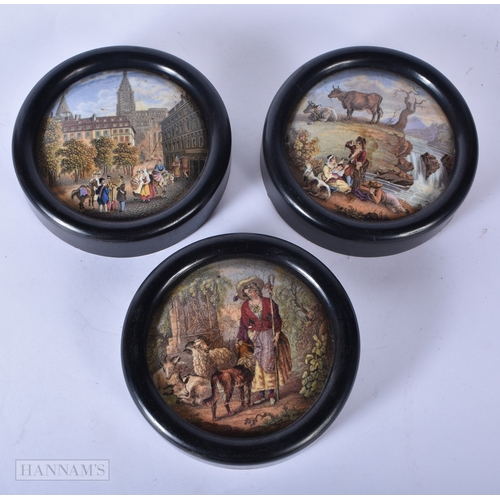 A collection of antique framed ceramic pot lids 15.5 cm