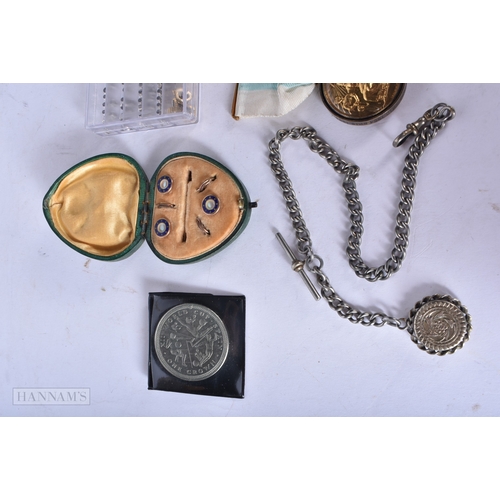 A small compass on a fob together with a collection of watch winders ...