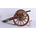 A COUNTRY HOUSE HAND CRANK MODEL OF A CANNON. 65 cm x 30 cm.