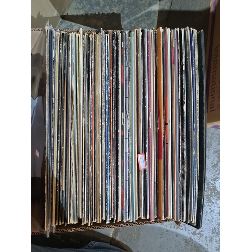 Box of vinyl LP records including 1970s rock