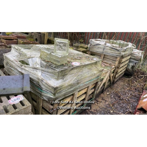 FOUR CRATES OF ASSORTED GLASS BRICKS, MIXED SIZES