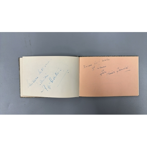 A small multi signed autograph book, autographs include Norman Wisdom ...