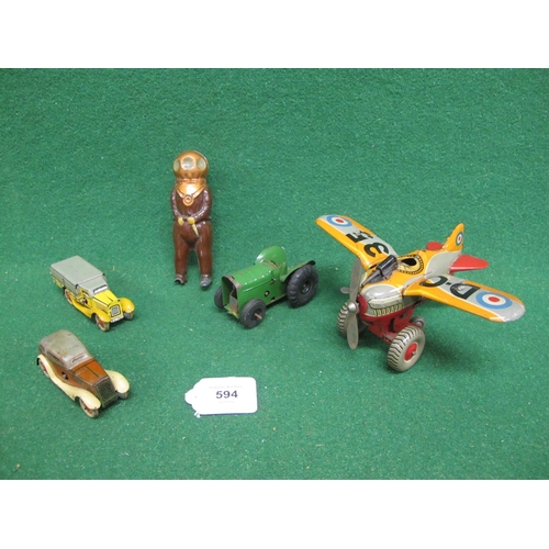 Four clockwork tinplate toys to comprise: a Made In Japan by KT fighter ...