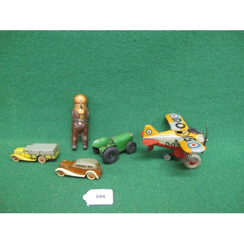 Four clockwork tinplate toys to comprise: a Made In Japan by KT fighter ...
