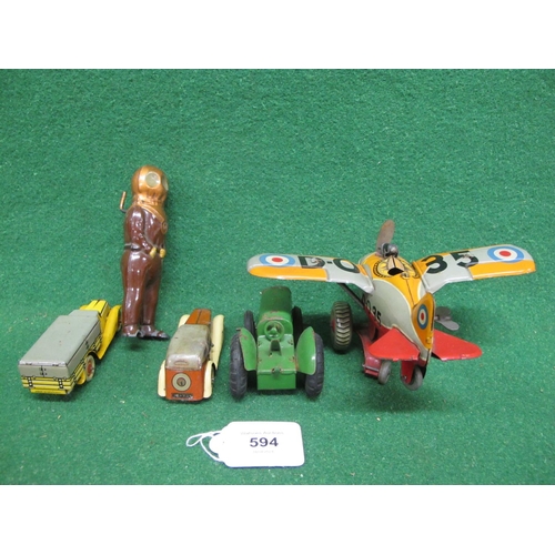 Four clockwork tinplate toys to comprise: a Made In Japan by KT fighter ...