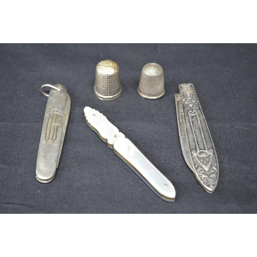 Two silver thimbles together with a Rogers Mother of Pearl handled ...