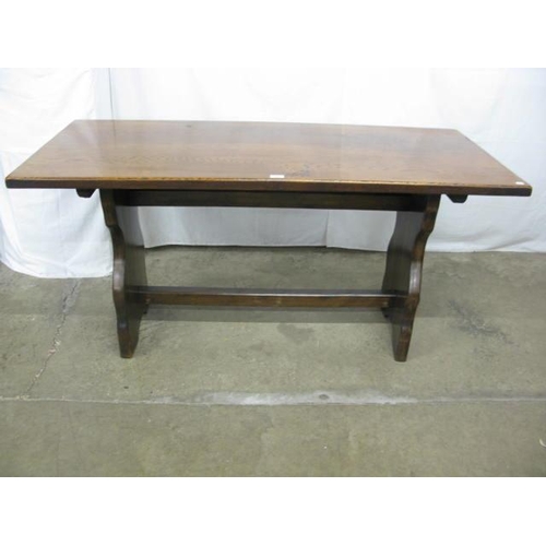 Oak refectory table standing on shaped end supports with two hole and ...