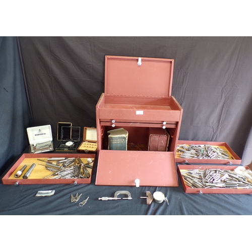 Metal tool chest with various engineers tools
