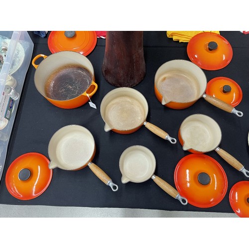 Le Creuset - graduated set of five pans with lids, colour flame, sizes ...