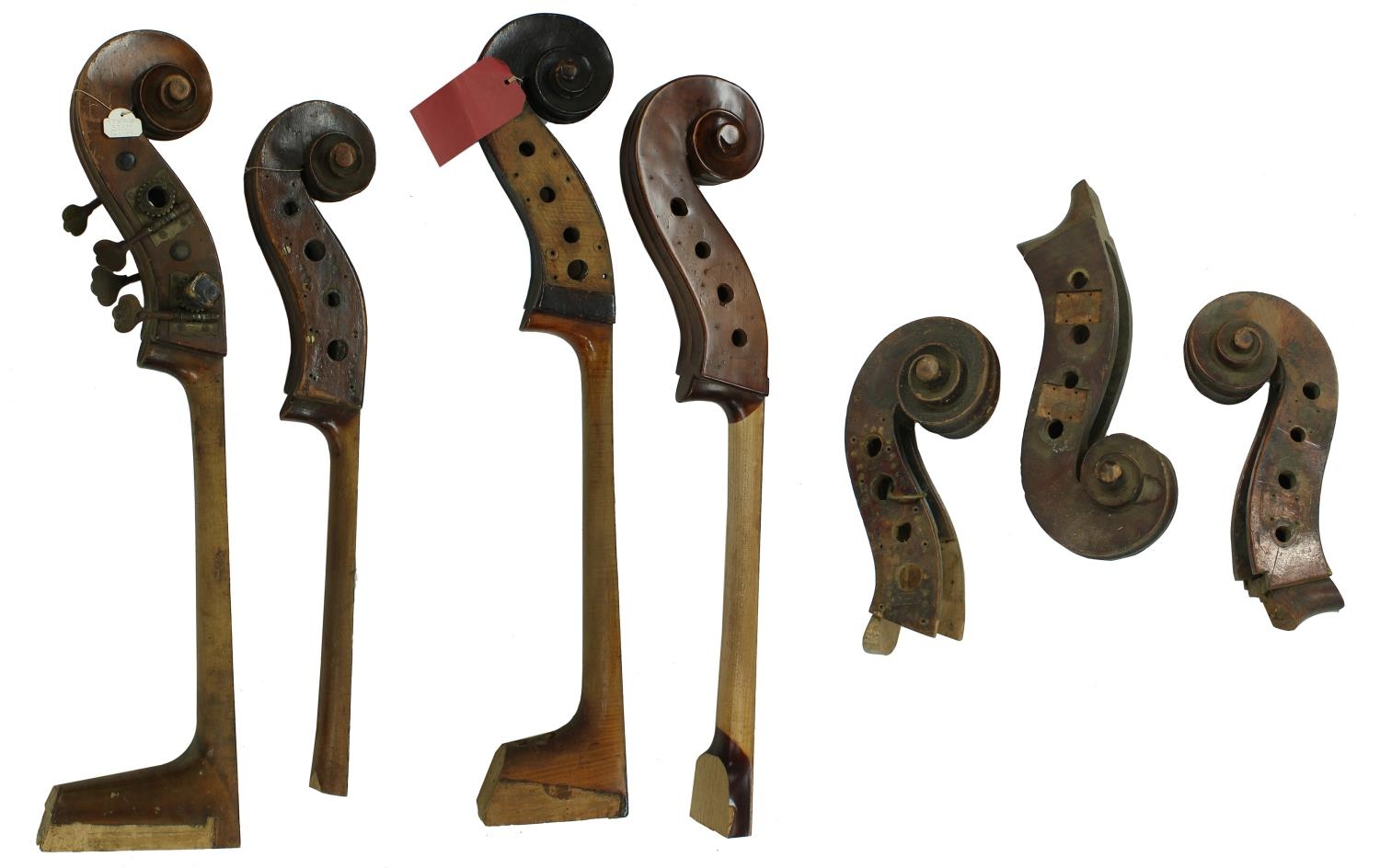 Seven old double bass scrolls, four complete with necks (7)