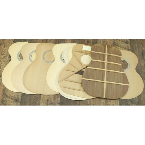 Seven unfinished spruce acoustic guitar tops; together with another ...