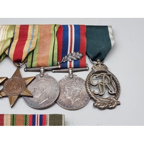 Medals: a group of seven, to Lieutenant Commander F.N.B Johnson, R.N ...