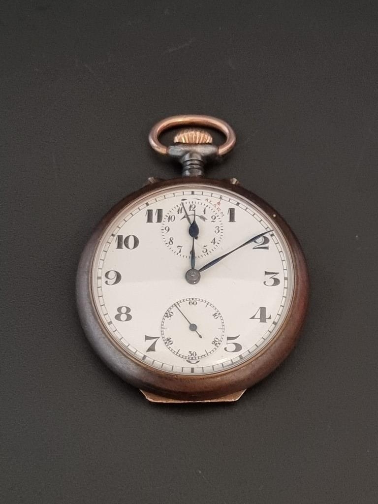 A circa 1910 Zenith gun metal open faced stem wind alarm pocket watch ...