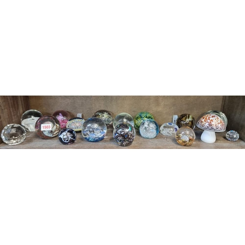 A collection of glass paperweights, to include examples by Caithness ...