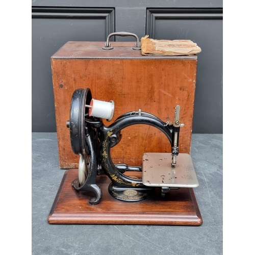 A Willcox & Gibbs 'Automatic Silent' sewing machine, cased and with ...