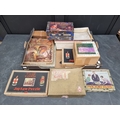 Pastimes: a collection of boxed vintage jigsaw puzzles.