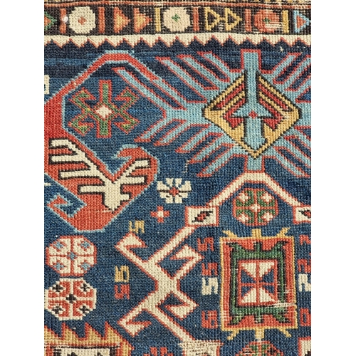 A Caucasian rug, having geometric borders, 152 x 123cm.
