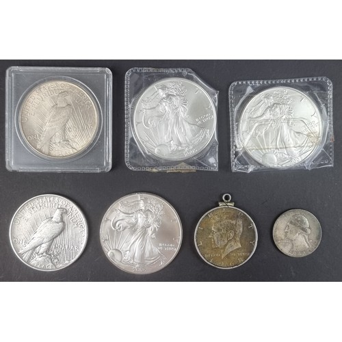 Coins: US, three 2005 American Eagle silver dollars; together with two ...