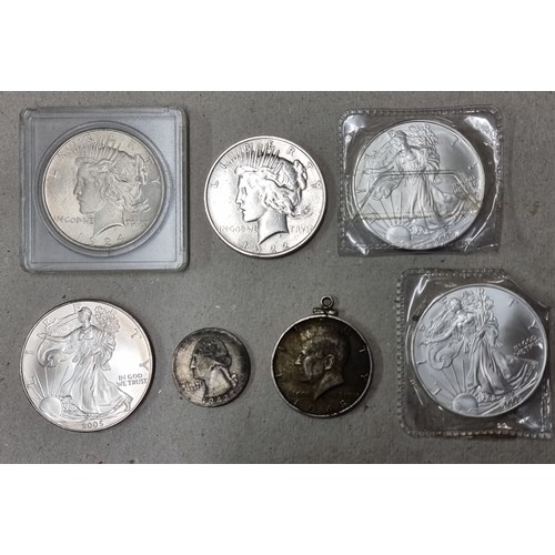 Coins: US, three 2005 American Eagle silver dollars; together with two ...