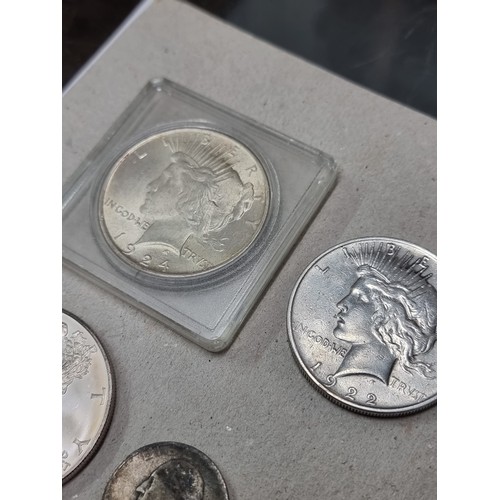 Coins: US, three 2005 American Eagle silver dollars; together with two ...