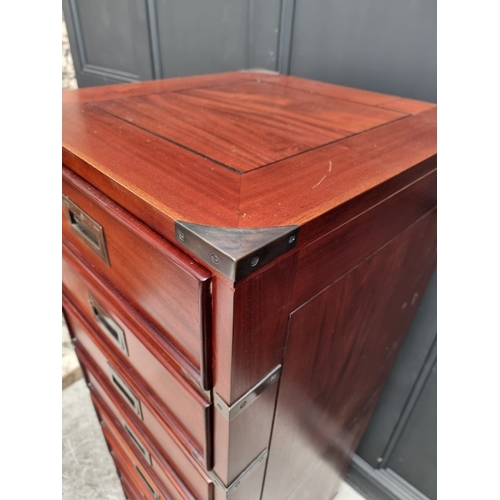 A contemporary mahogany campaign style filing cabinet, with four ...