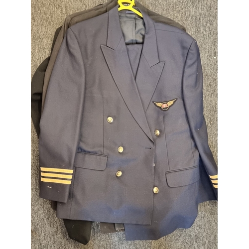 A vintage British Airways pilot's jacket, cap and trousers, together ...